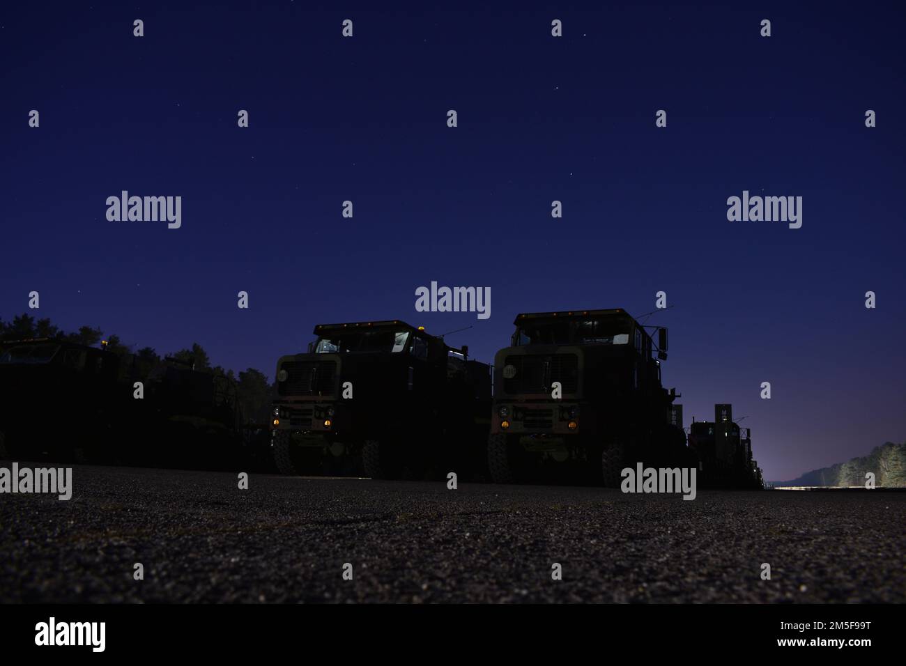 Several Bobtail truck tractors and enhanced heavy equipment trailers ...