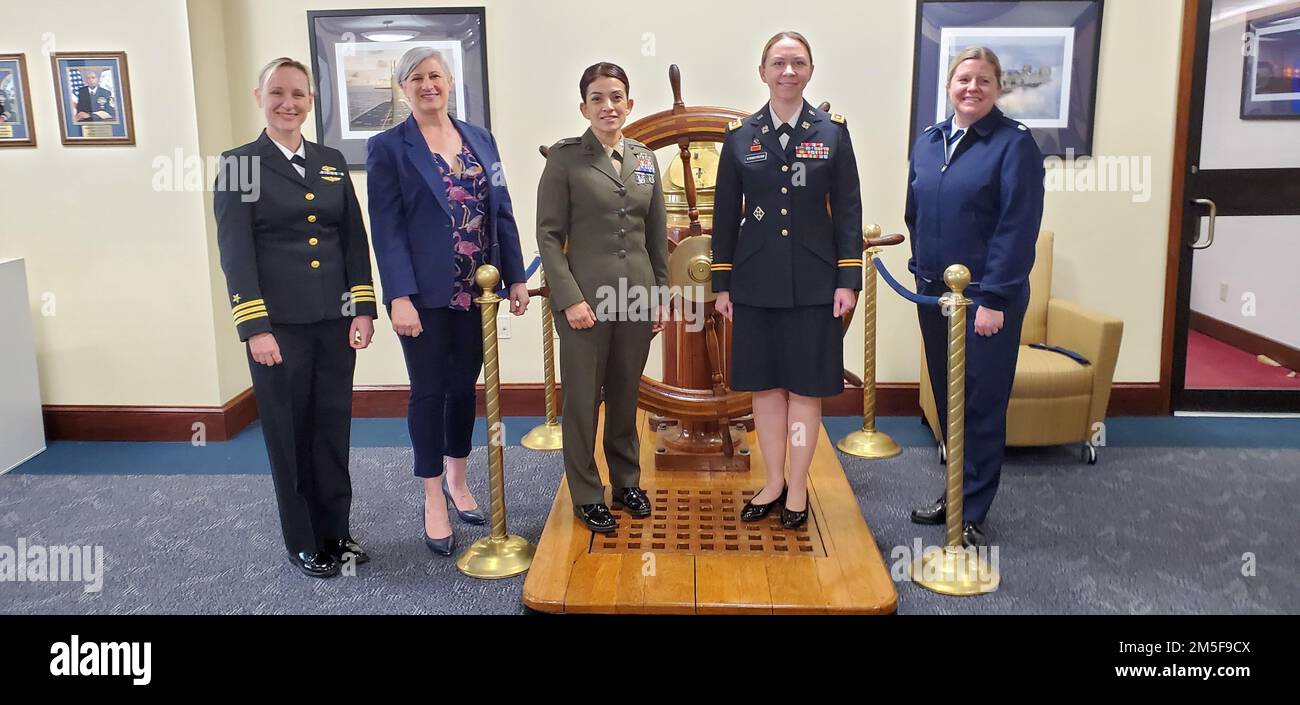 Navy Cmdr. Rebecca L. Young, Ms. Amber D. Tucker, a DoD civilian ...