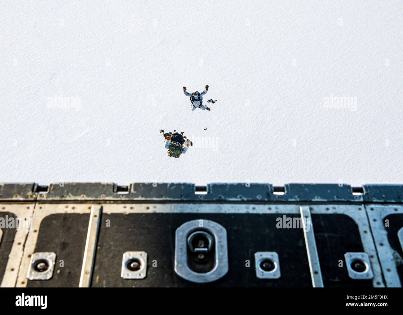 Naval Special Warfare members perform a high-altitude low-opening jump ...
