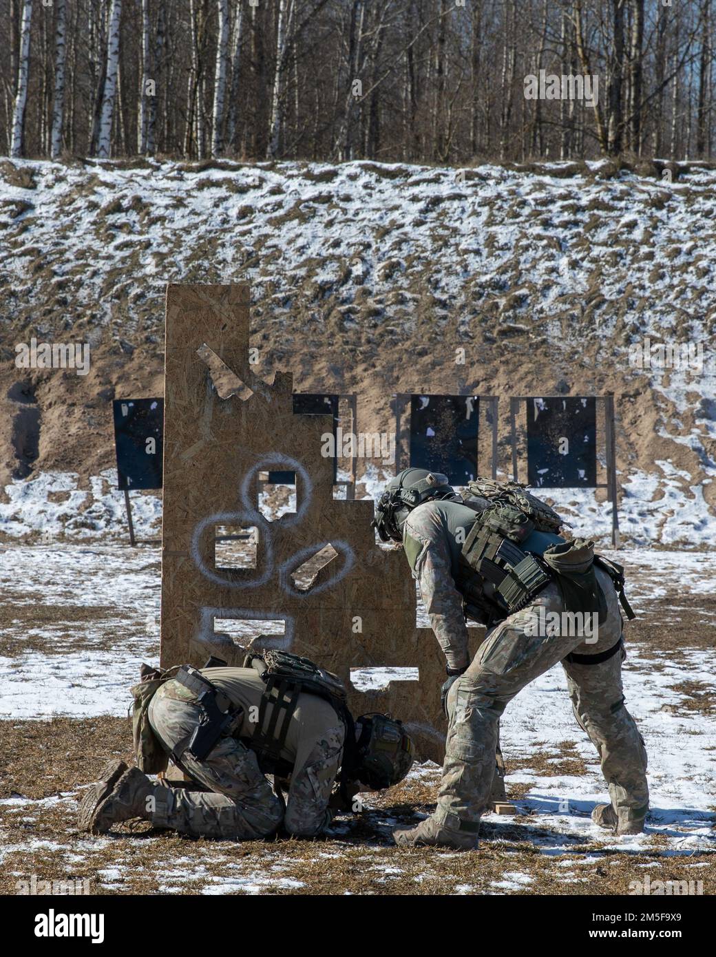 A Lithuanian SOF Jaeger shoots through an 11-hole panel on a range near ...