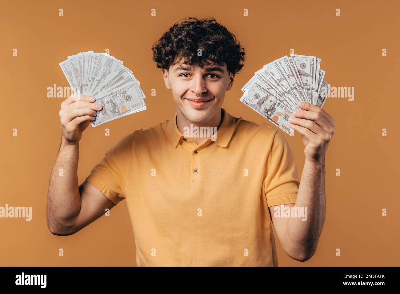 Rich excited man with cash money - USD currency dollars banknotes on ...