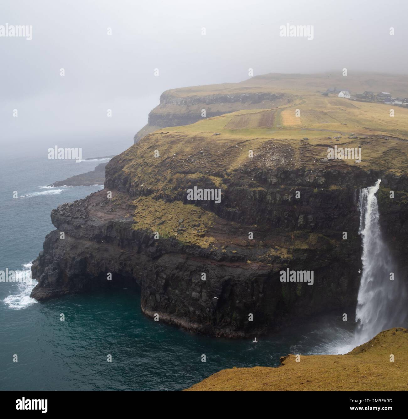 Múlafossur waterfall bellow Gásadalur hamlet Stock Photo - Alamy