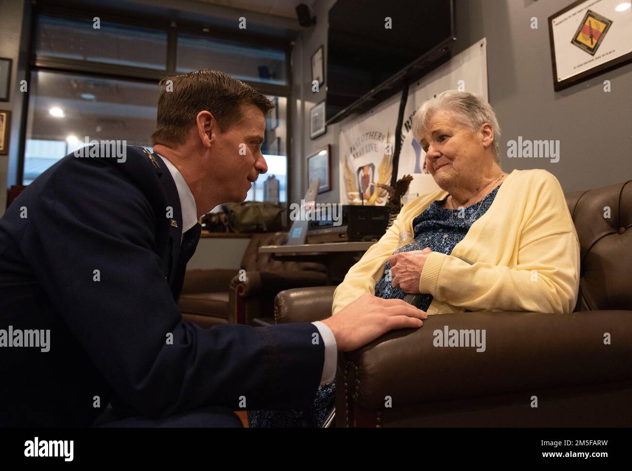 U.S. Air Force Col. Russ Cook, 23rd Wing commander, presents a coin to ...