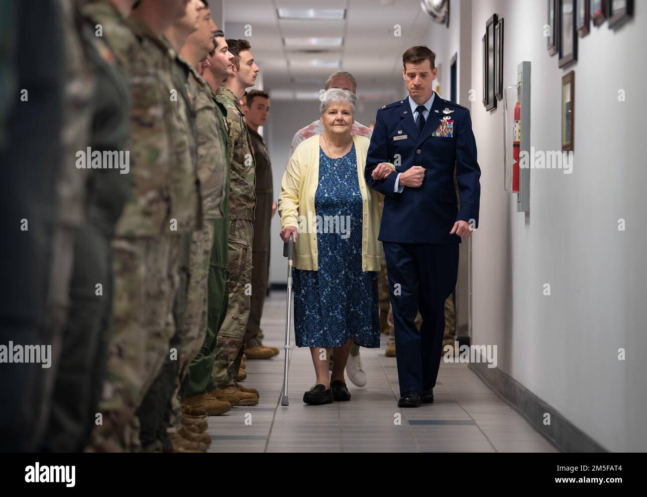 U.S. Air Force Col. Russ Cook, 23rd Wing commander, escorts Catherine ...