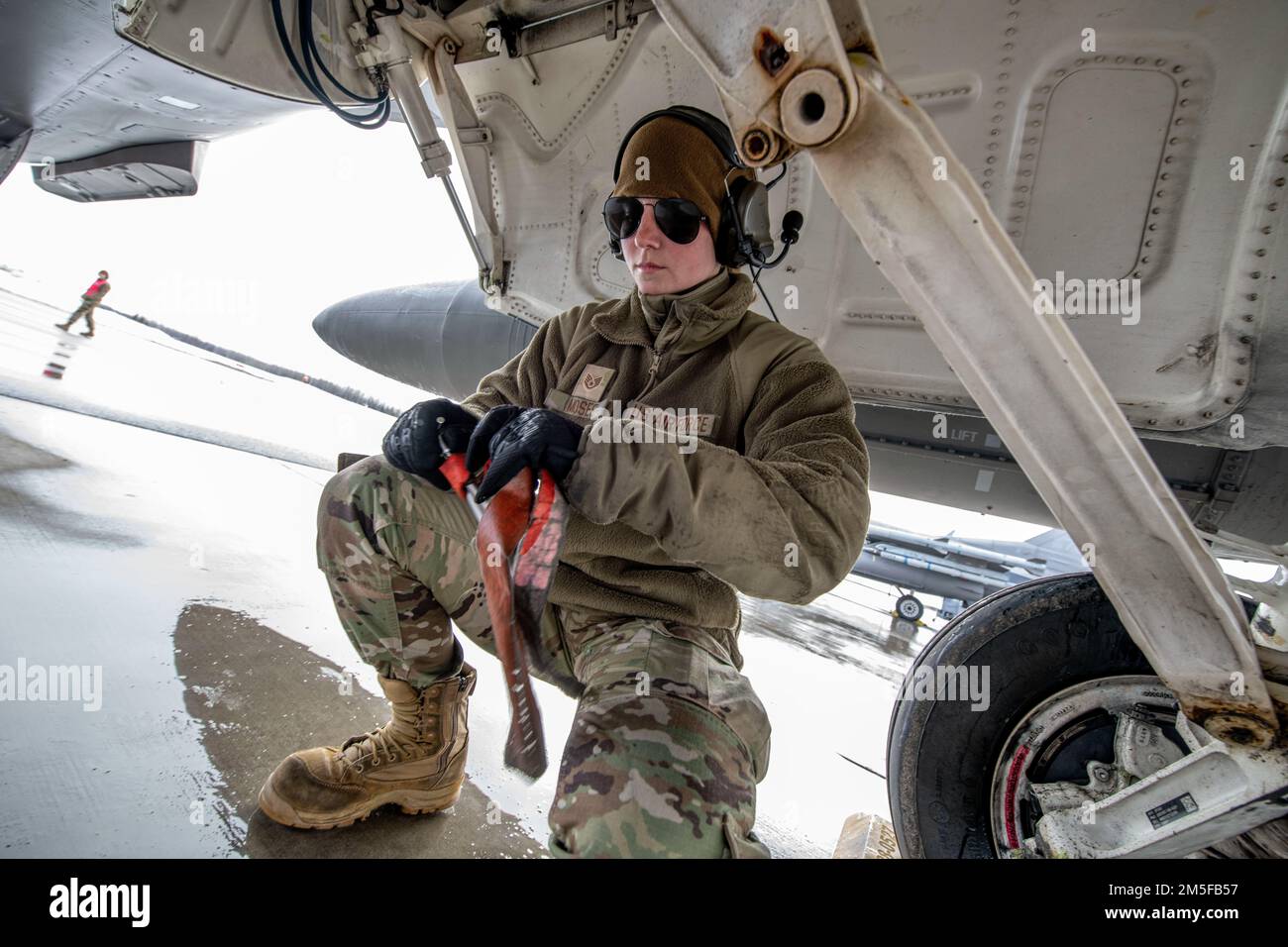 U.S. Air Force Staff Sgt. Kate Moses, a crew chief assigned to Ohio ...