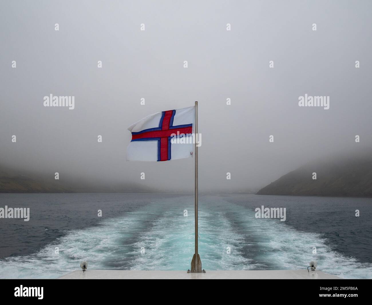 Faroe Islands flag waving in a boat Stock Photo - Alamy