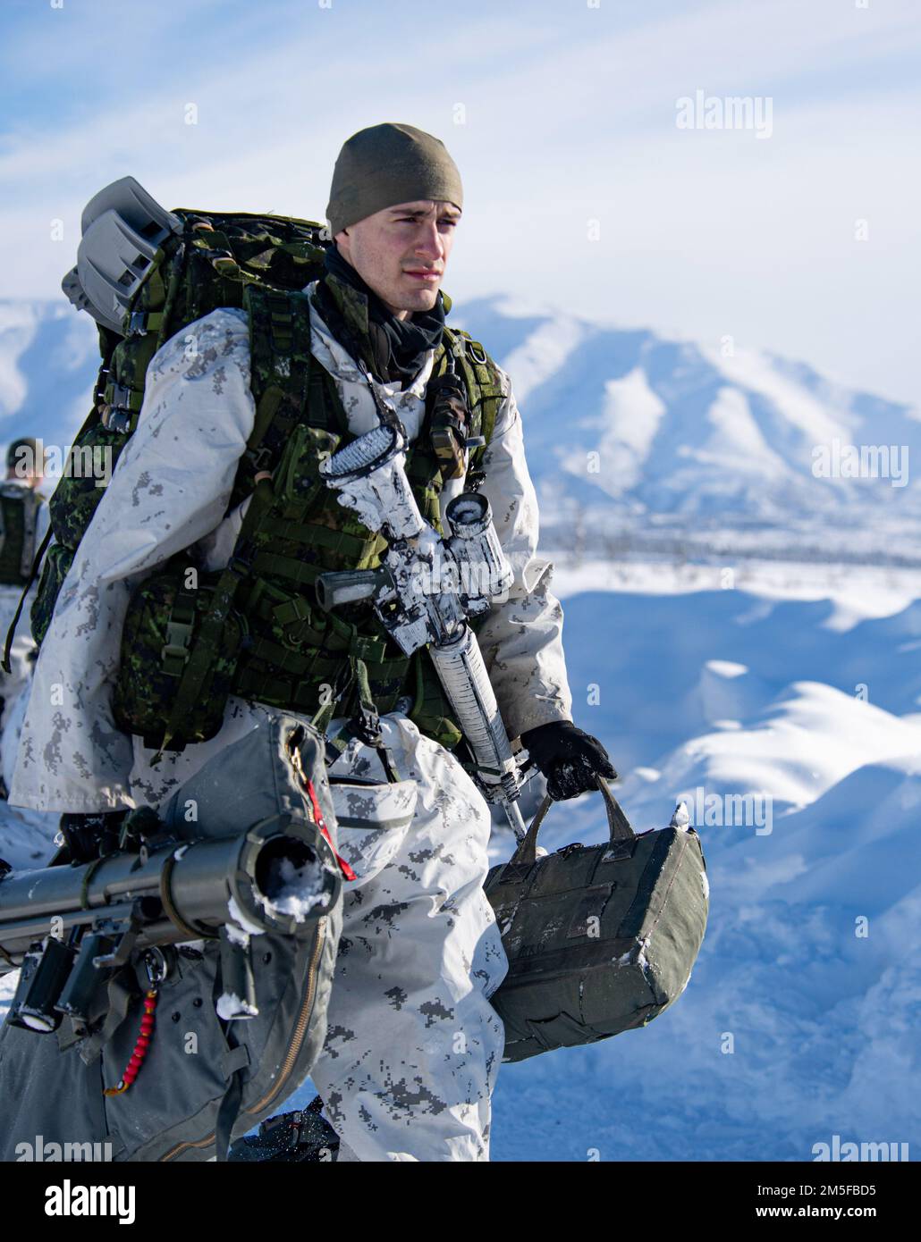 A member of the 3rd Battalion, Royal 22e Régiment Canadian Army hike to ...