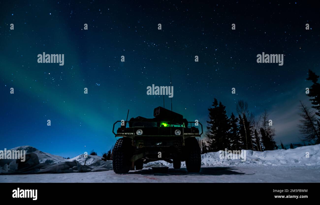 The northern lights glow above an Avenger Air Defense System assigned ...