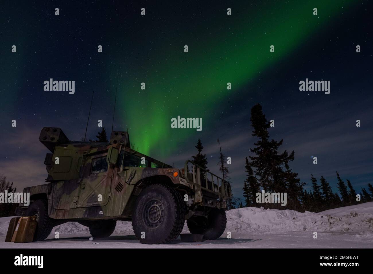 The northern lights glow above an Avenger Air Defense System assigned ...