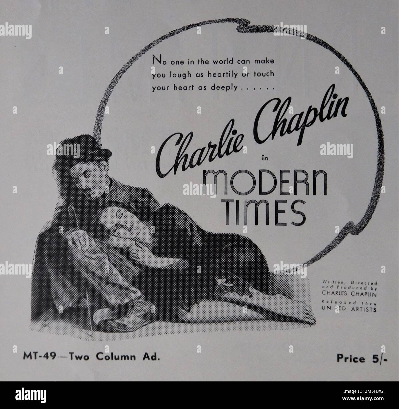 CHARLIE CHAPLIN as The Tramp and PAULETTE GODDARD as a Gamin in MODERN ...