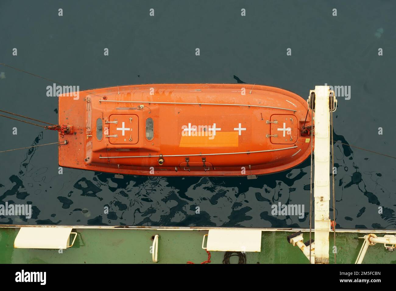 Top view on the orange colour life boat with reflective tape stickers ...