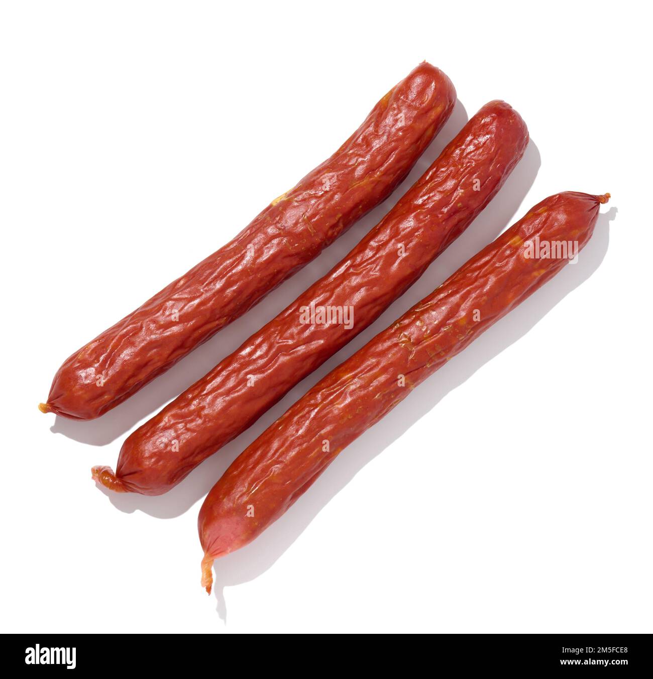 Small smoked sausages on a white isolated background, top view Stock ...