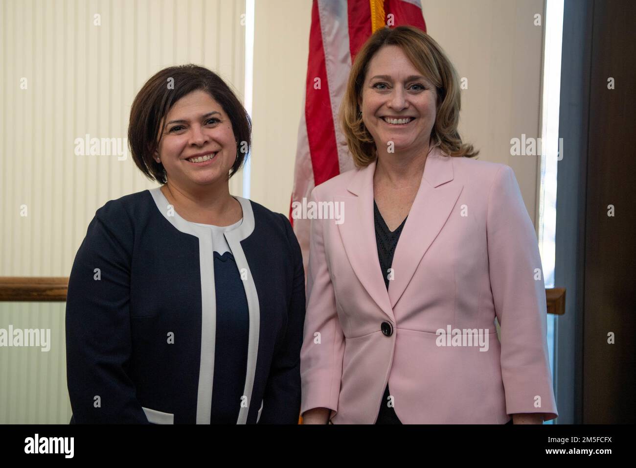Deputy Secretary of Defense Kathleen H. Hicks stands with Ericka ...