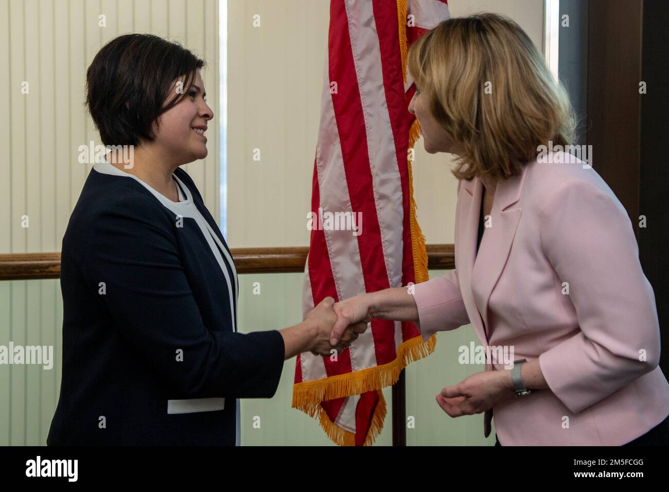 Deputy Secretary of Defense Kathleen H. Hicks stands with Ericka ...