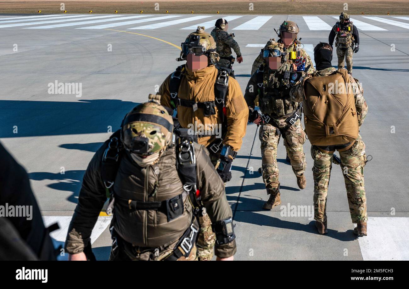 A U.S. Army Special Forces Operator high fives U.S. Special Tactics ...