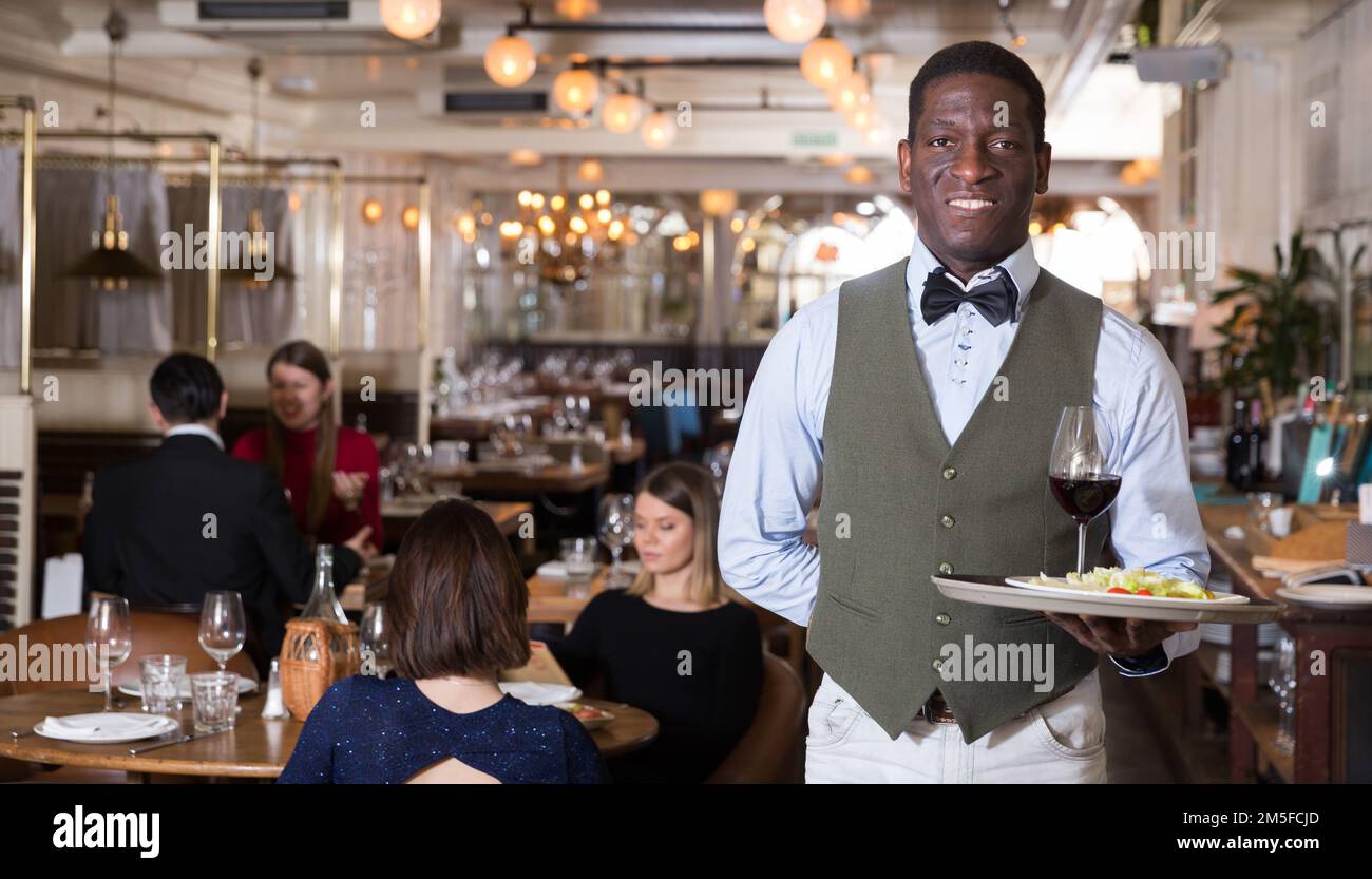African American waiter with serving tray Stock Photo - Alamy