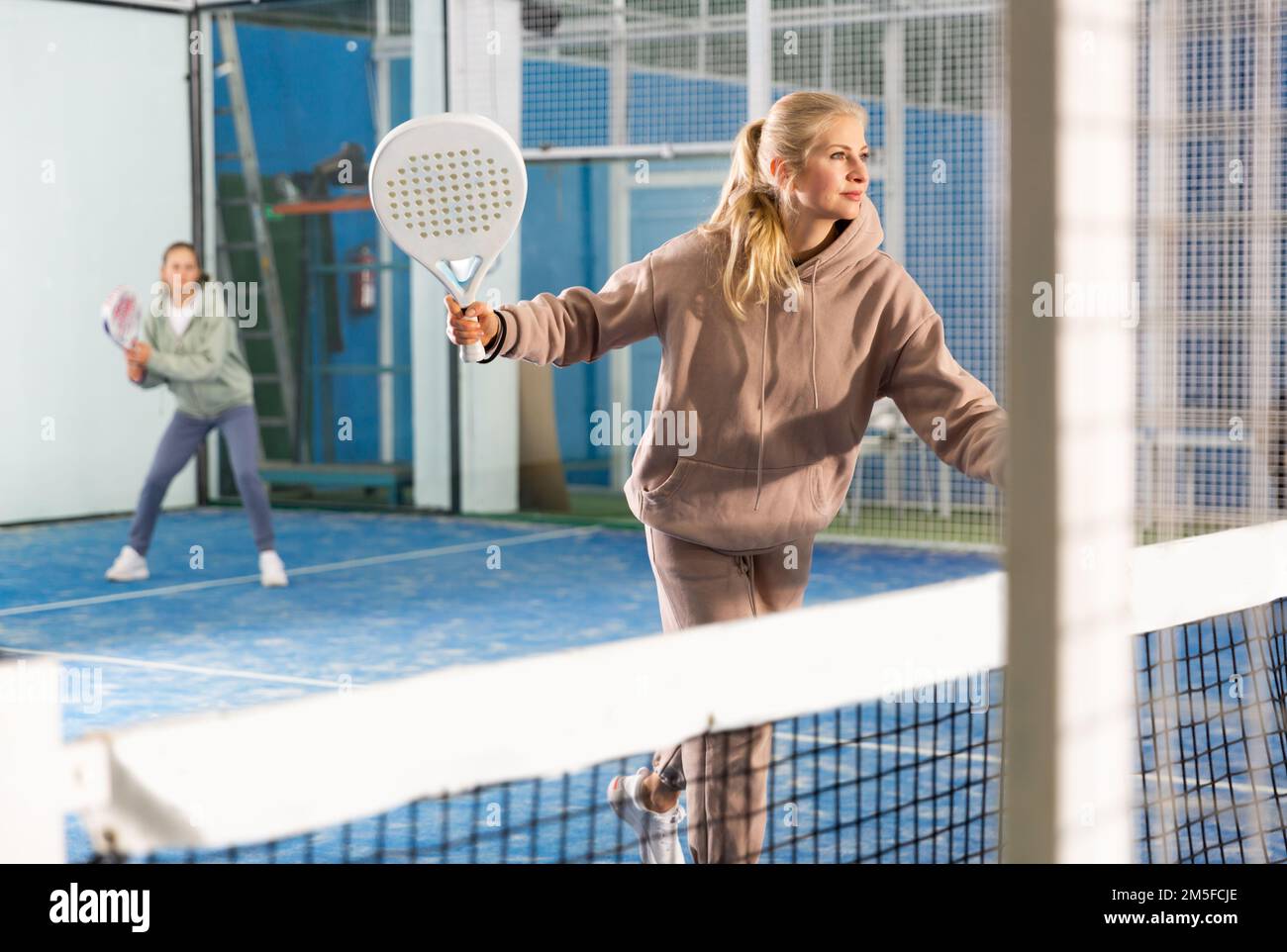 European woman playing padel Stock Photo - Alamy