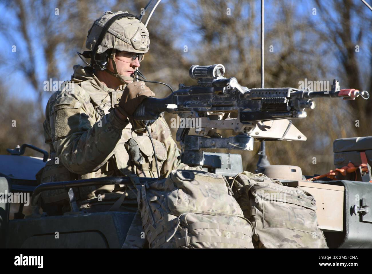 A U.S. Soldier with the 41st Field Artillery Brigade operates the M240 ...