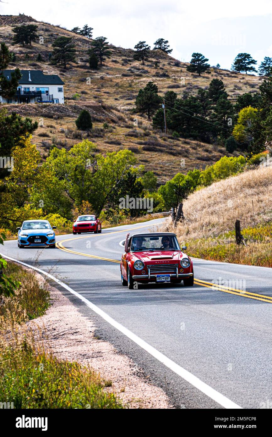 A beautiful vertical view of cars on the mountain road Stock Photo - Alamy
