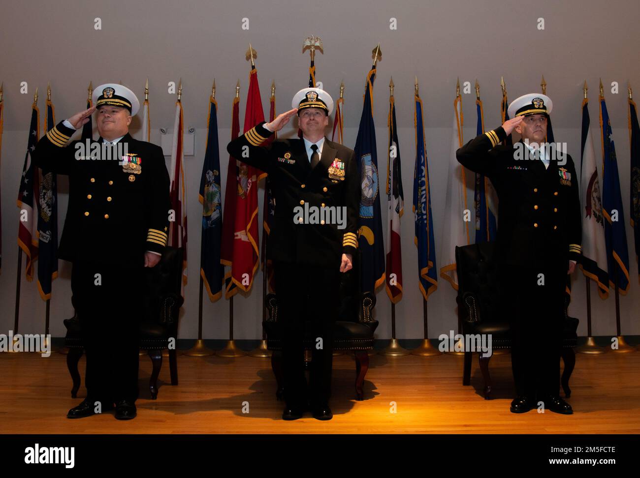 NEWPORT, R.I. (March 11, 2022) Members of the official party salute ...