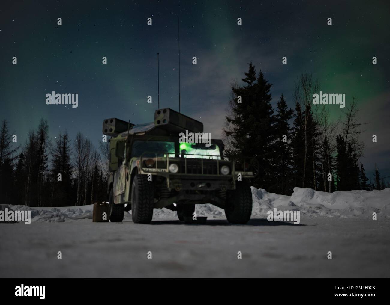 The northern lights glow above an Avenger Air Defense System assigned ...