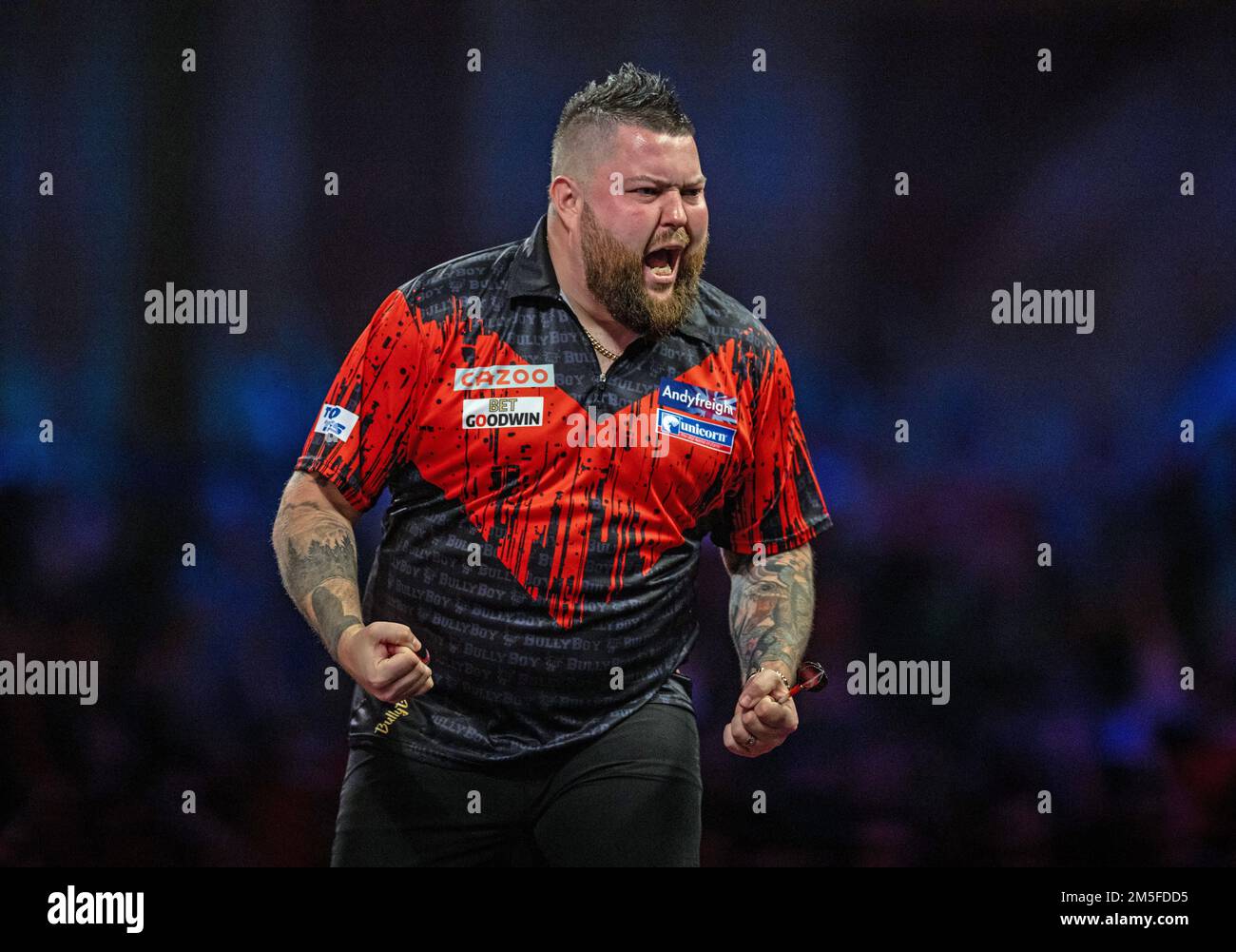 Michael Smith celebrates winning his match during day eleven of the ...