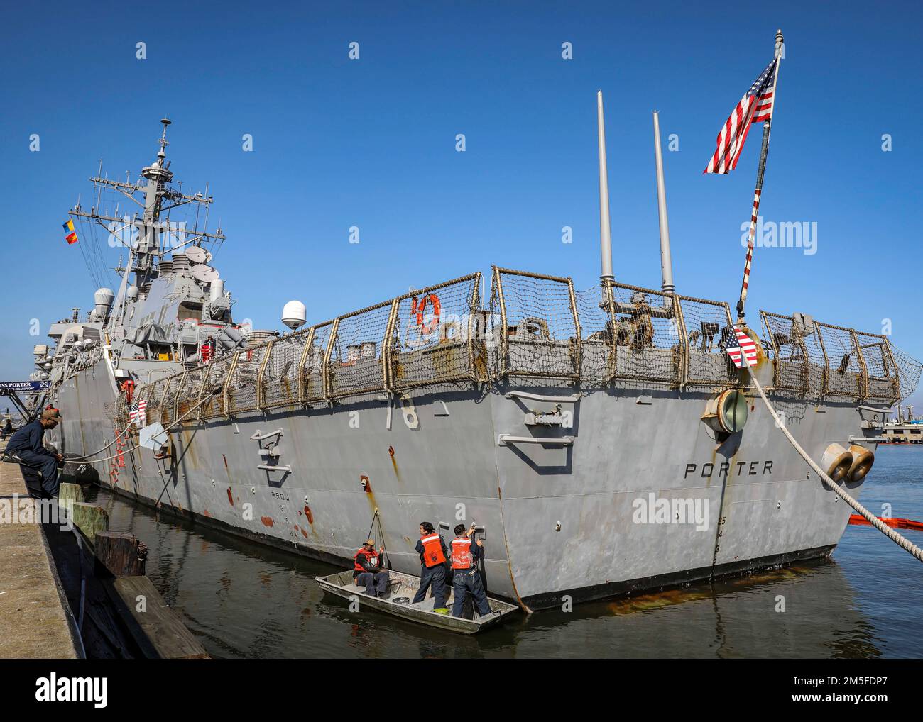 NORFOLK, Va. (March 11, 2022) – Sailors paint the side of the ship ...