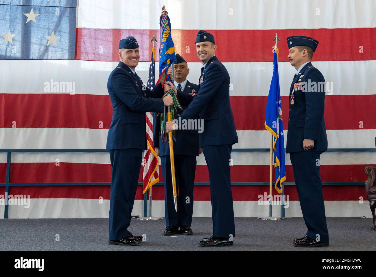Col. Derek Oakley, 28th Operations Group commander, presents the guidon of the 37th Bomb ...