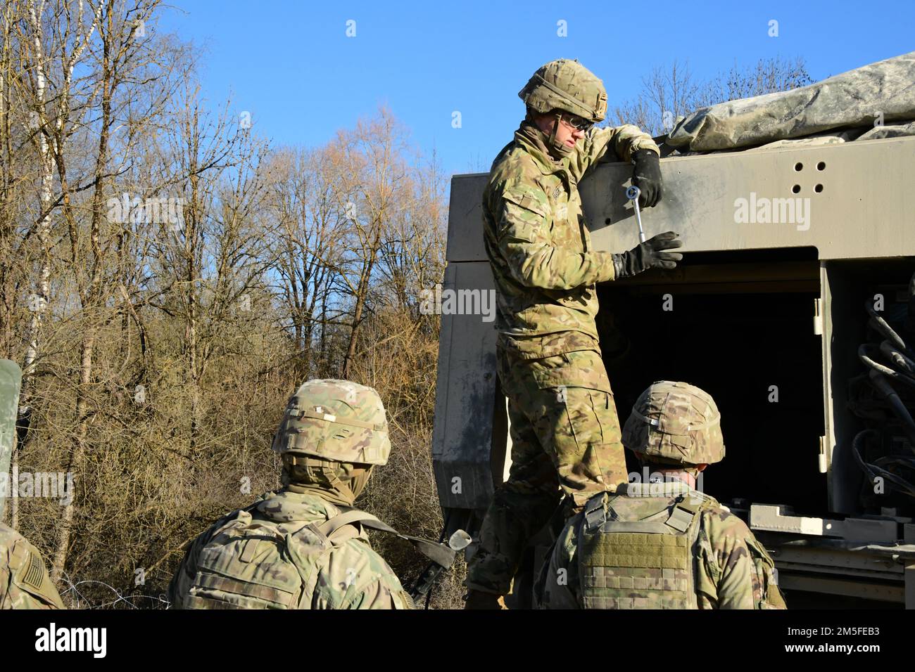 U.S. Soldiers assigned to 41st Field Artillery Brigade move a M270 ...
