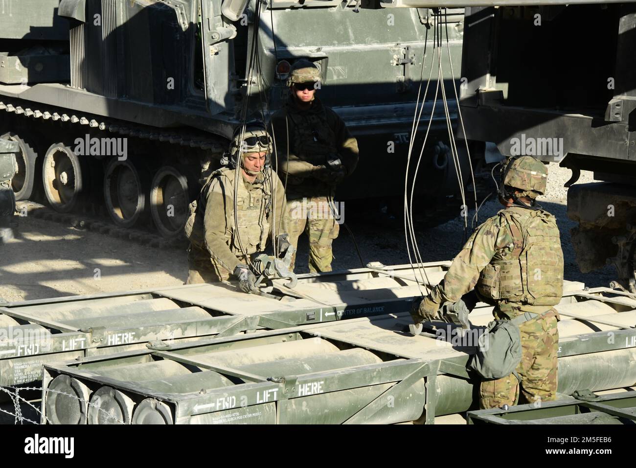 U.S. Soldiers assigned to 41st Field Artillery Brigade load M270 ...
