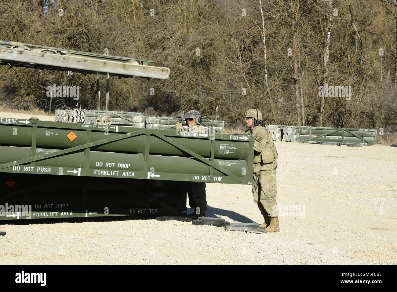 U.S. Soldiers assigned to 41st Field Artillery Brigade load M270 ...