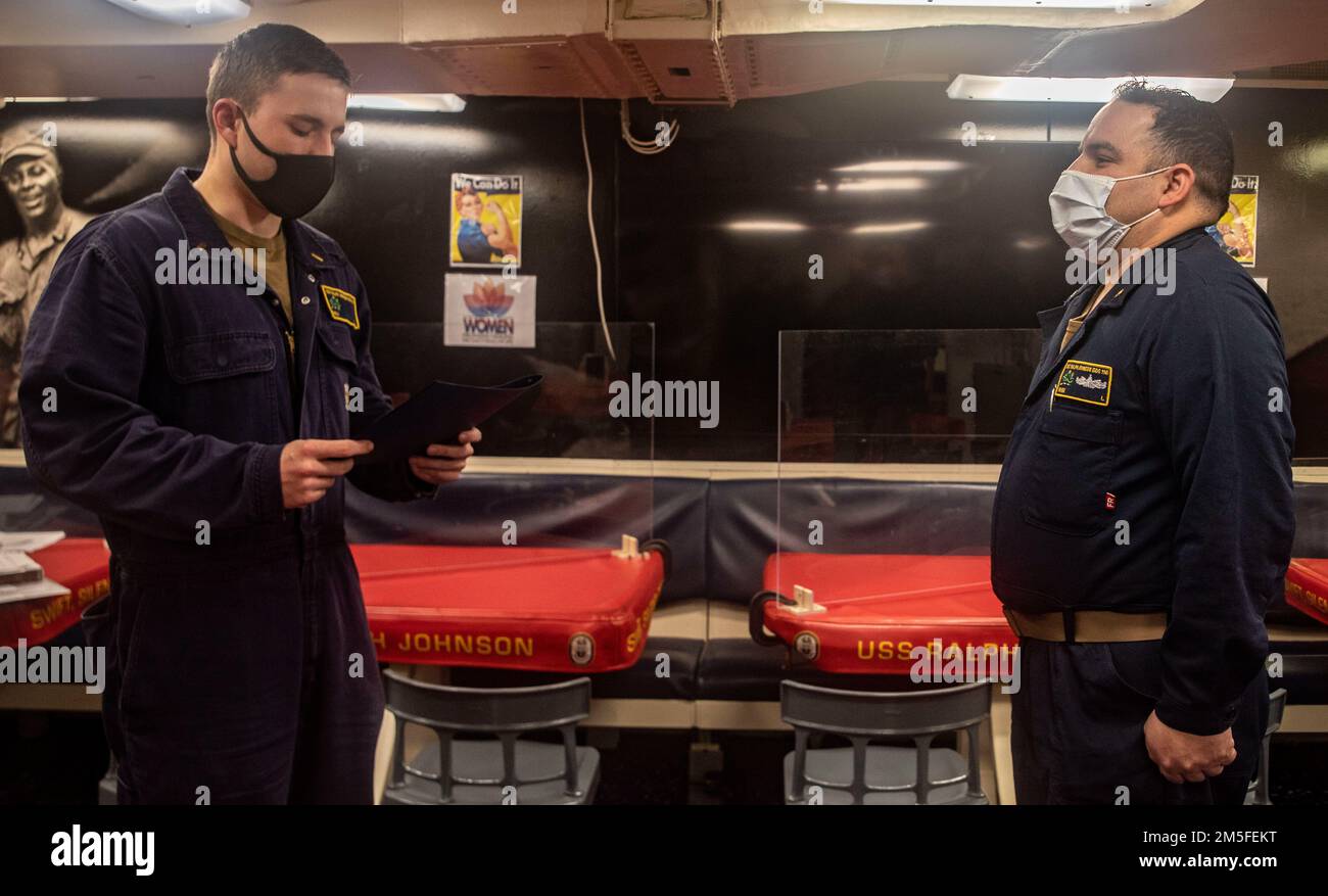 SOUTH CHINA SEA (March 11, 2022) Ensign Timothy Shea (left), from ...