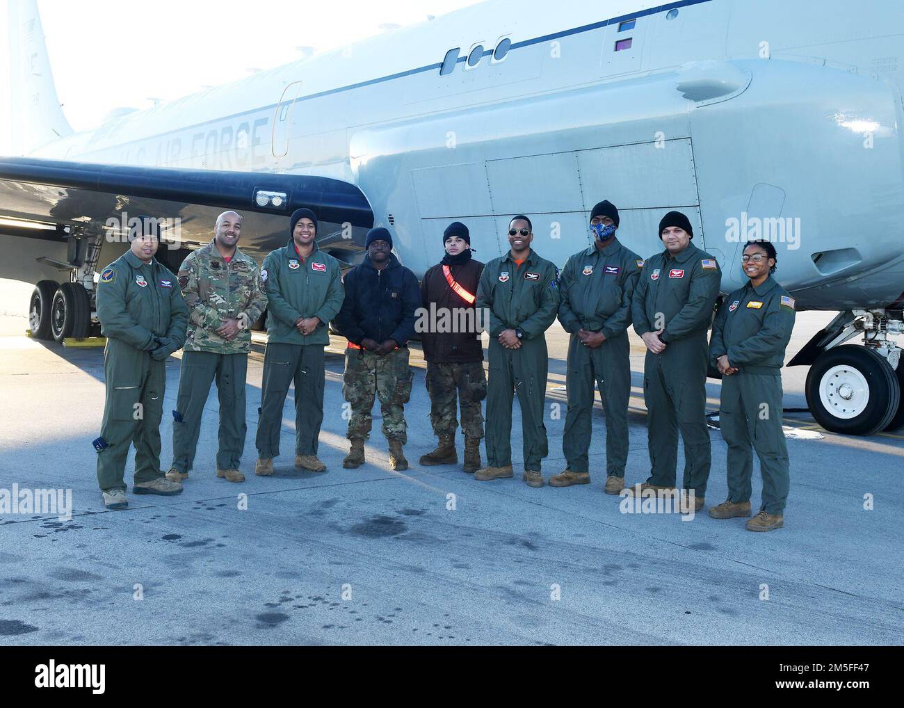 Team Offutt members pose for a photo March 11, in front of a RC-135S ...