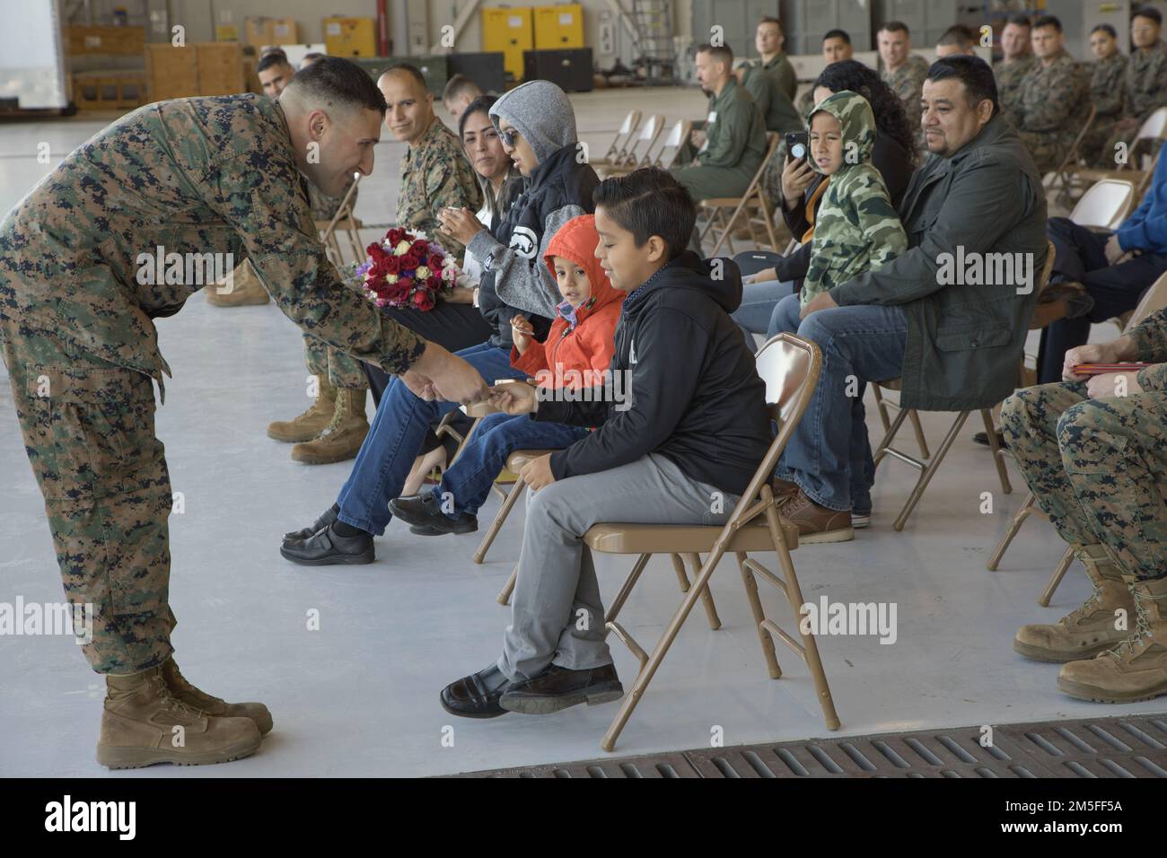 Master Sgt. Samuel Martinez’s children are given squadron coins by ...