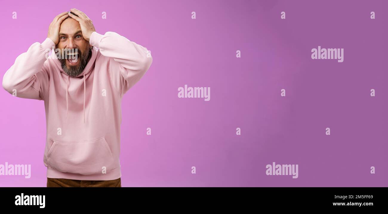 Angry mature bearded man holding hi-res stock photography and images ...