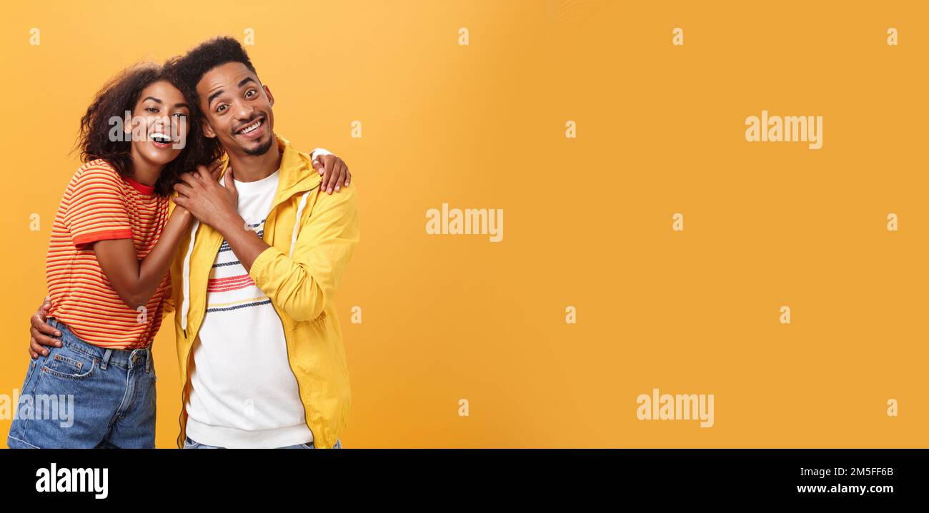 Friends always cover each other. Stylish and carefree loving african ...