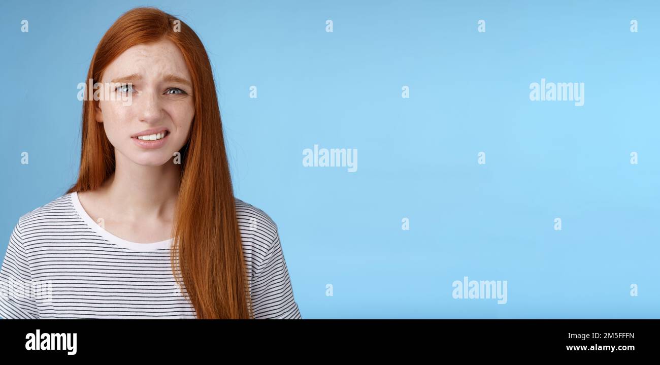Displeased young awkward redhead girl cringe full disbelief smirking ...