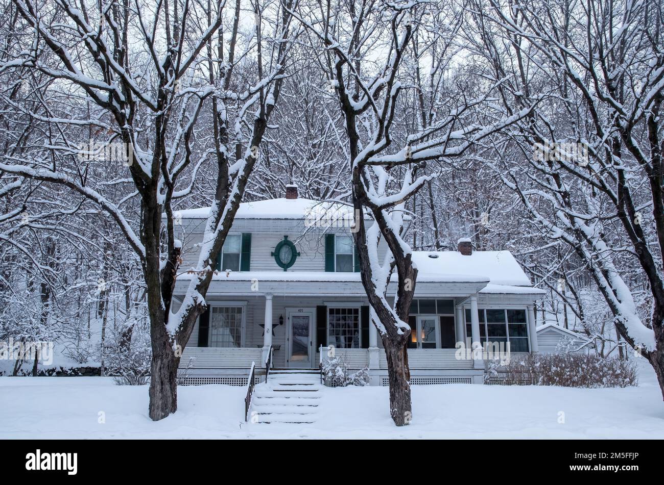 Historic 1912 Peter Nordeen house set back among the trees covered with ...
