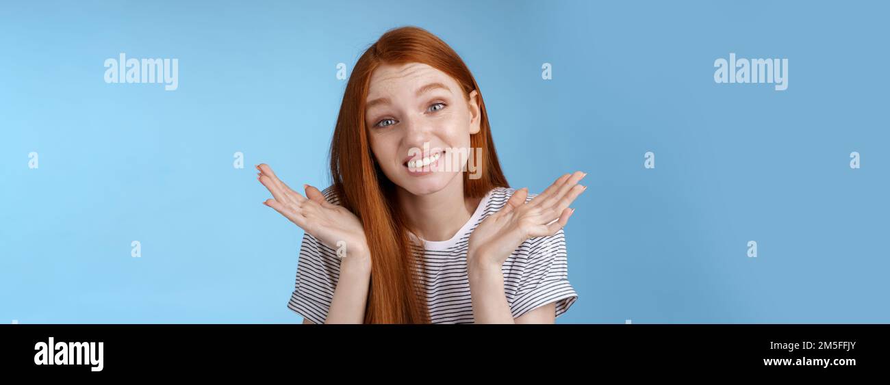 Awkward apologizing cute redhead girlfriend say sorry shrugging spread ...