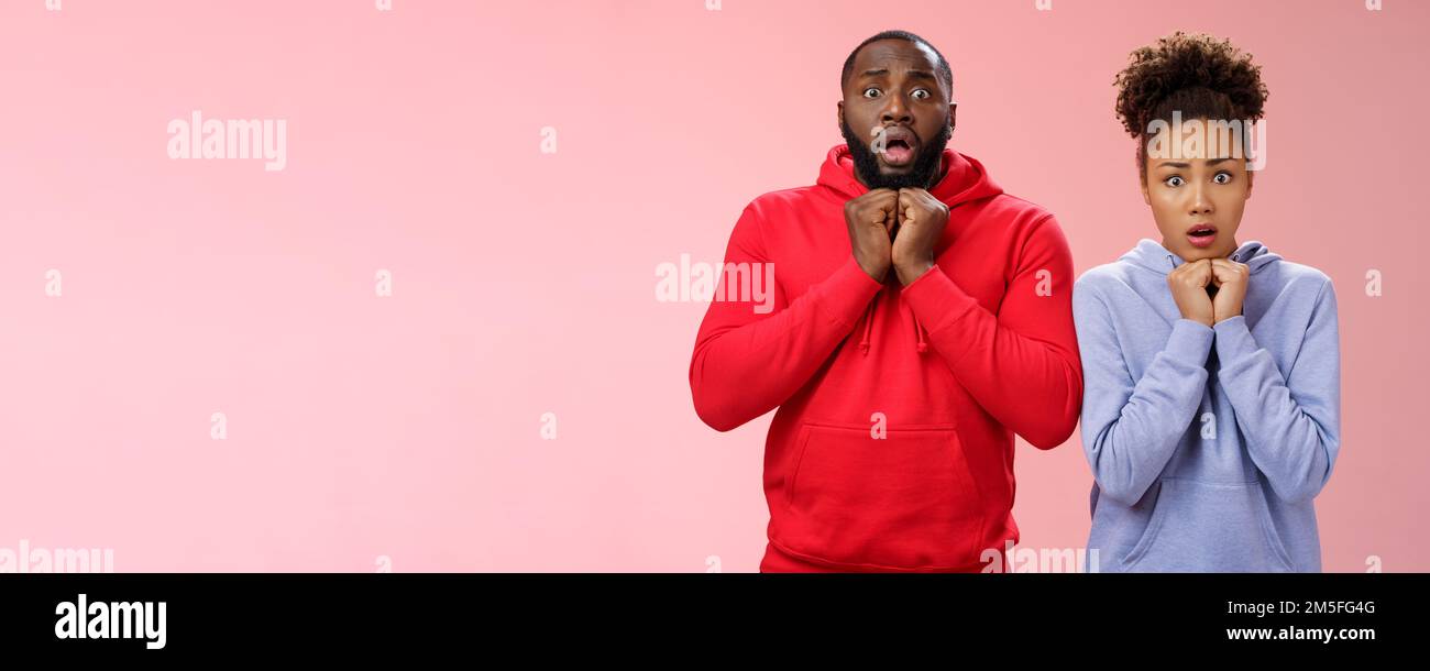 Upset worried two siblings watching together scary disturbing horror ...