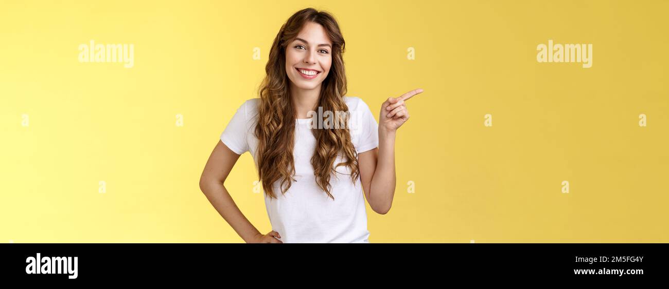 Amused young lady pointing looking hi-res stock photography and images ...