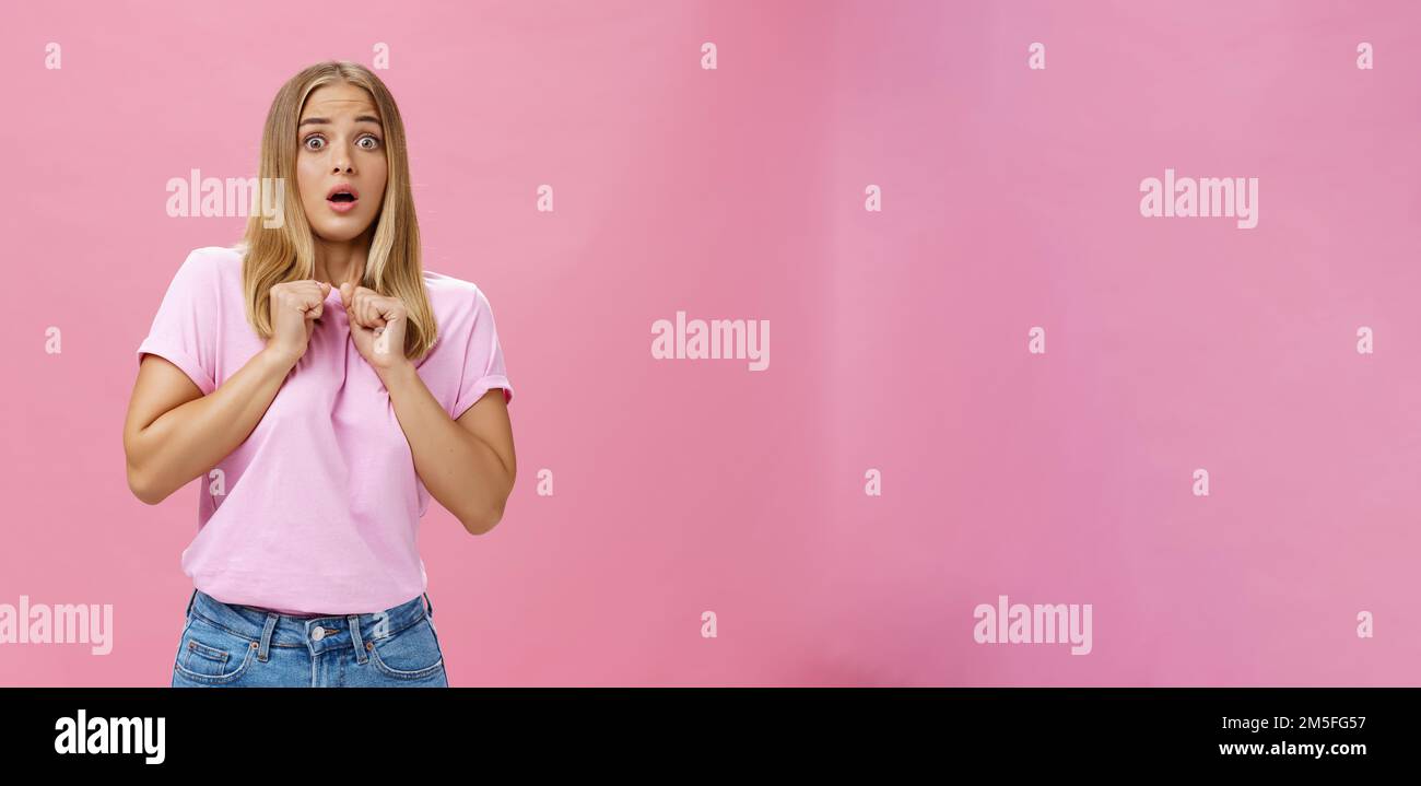 Woman gasping from fright being scared by someone pressing clenched ...