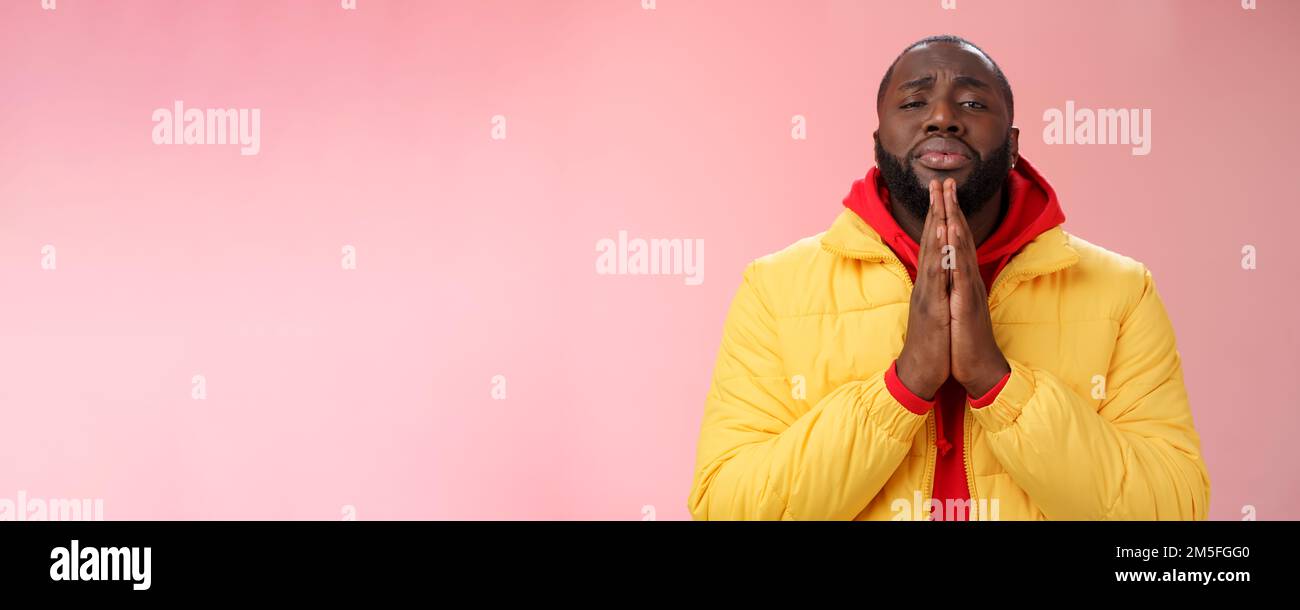 Miserable cute african-american bearded man in yellow coat asking help ...