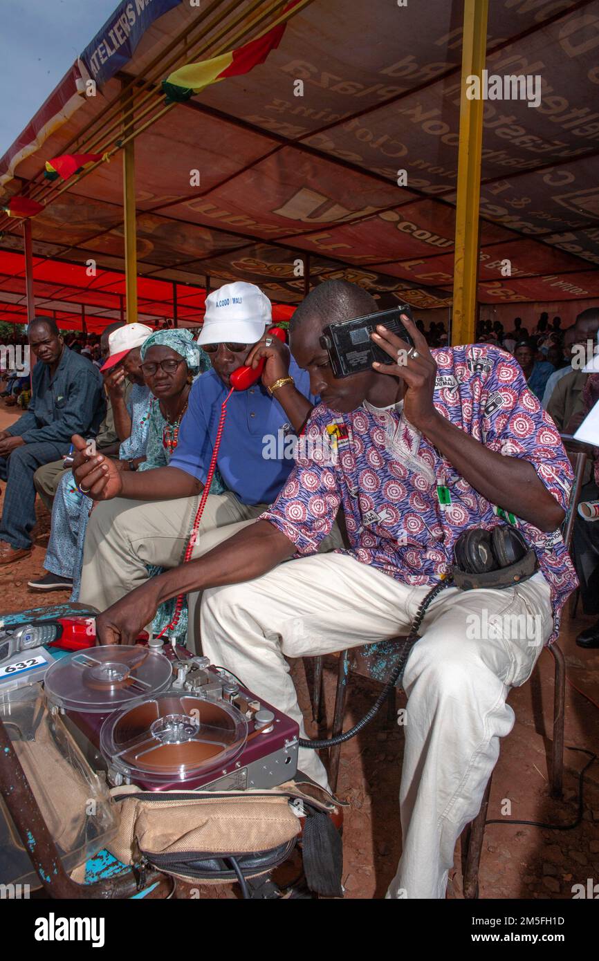 Reporter in africa with old tape machine Stock Photo - Alamy
