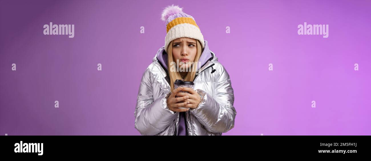 Trembling uncomfortable cute pouting young blond girl feel freezing ...