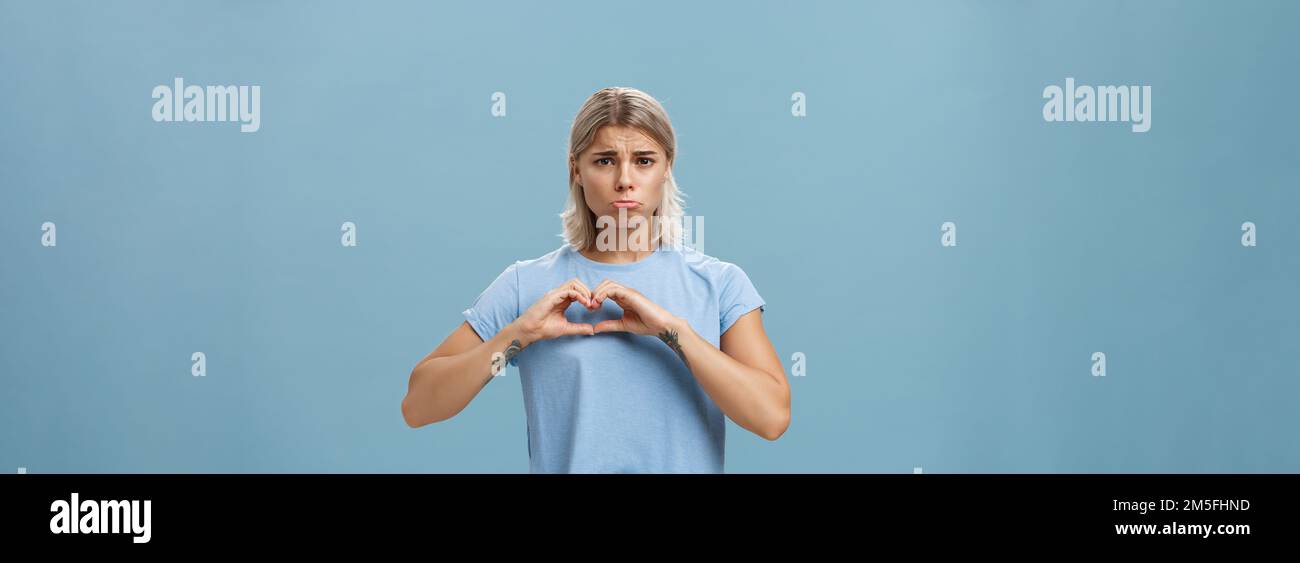 Heart being broken. Sad and gloomy heartbroken girl with blond hair ...