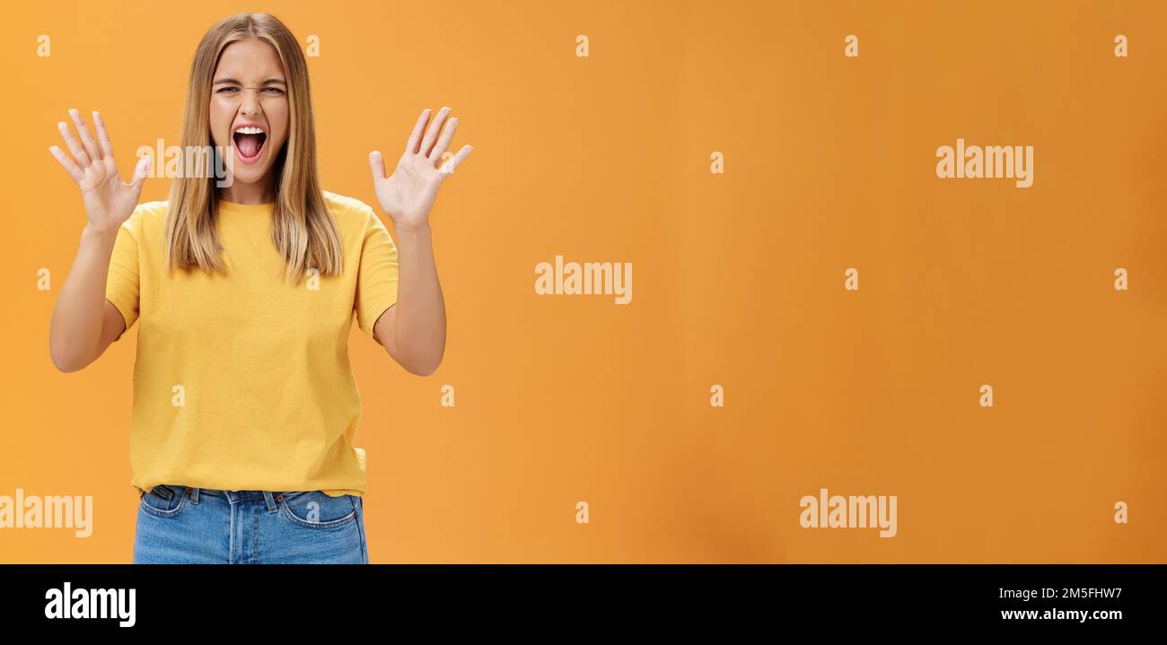 Woman releasing stress yelling with joy and pleasure gesturing with ...