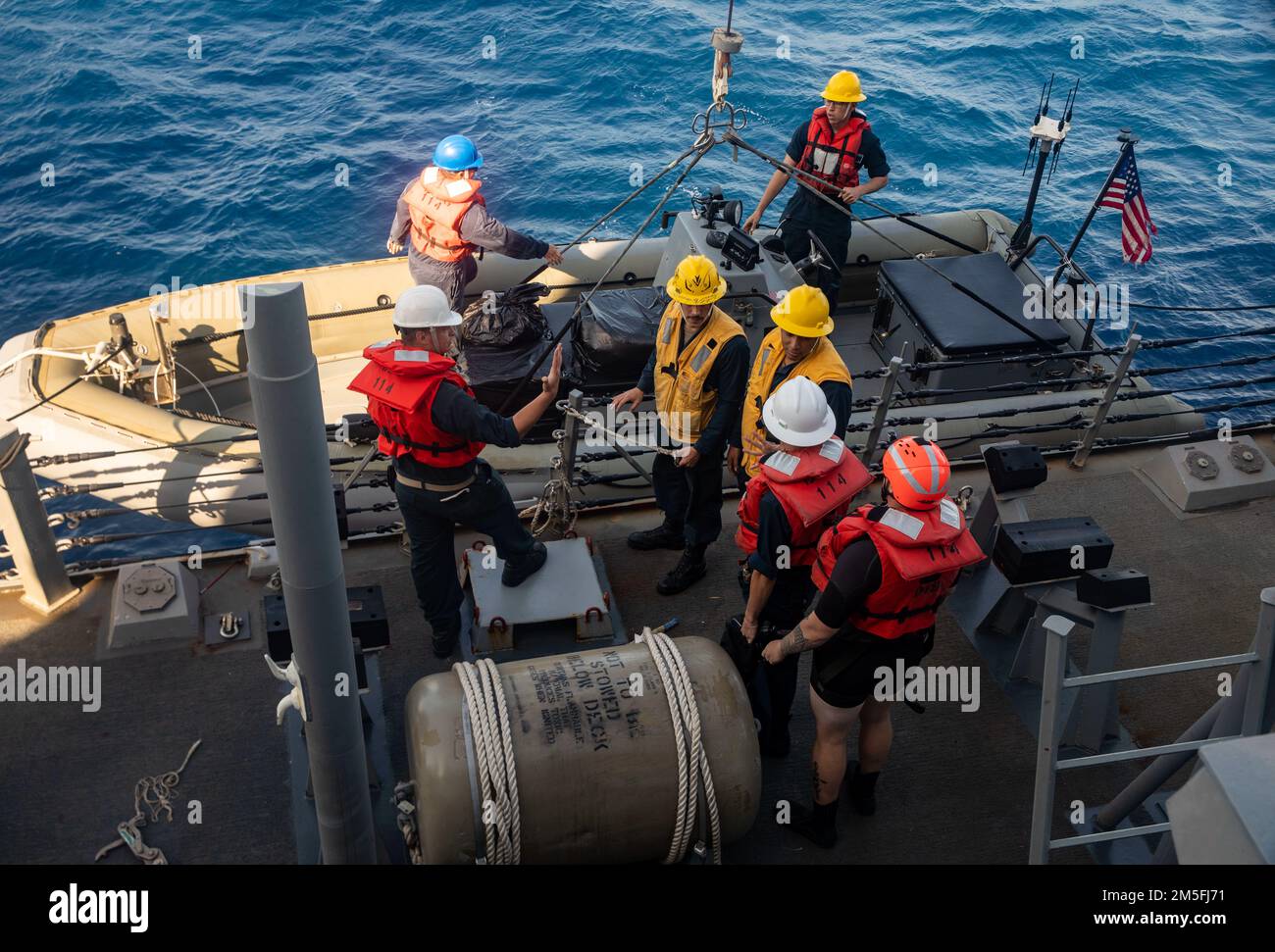 SOUTH CHINA SEA (March 12, 2022) Sailors aboard Arleigh Burke-class ...