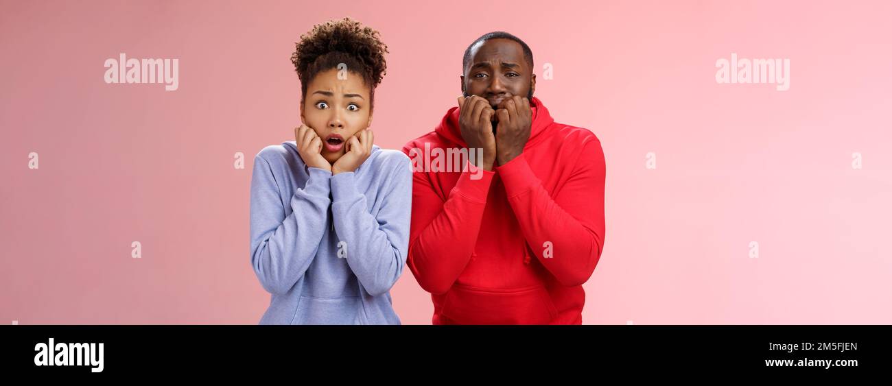 Shocked scared two insecure young african american couple both ...
