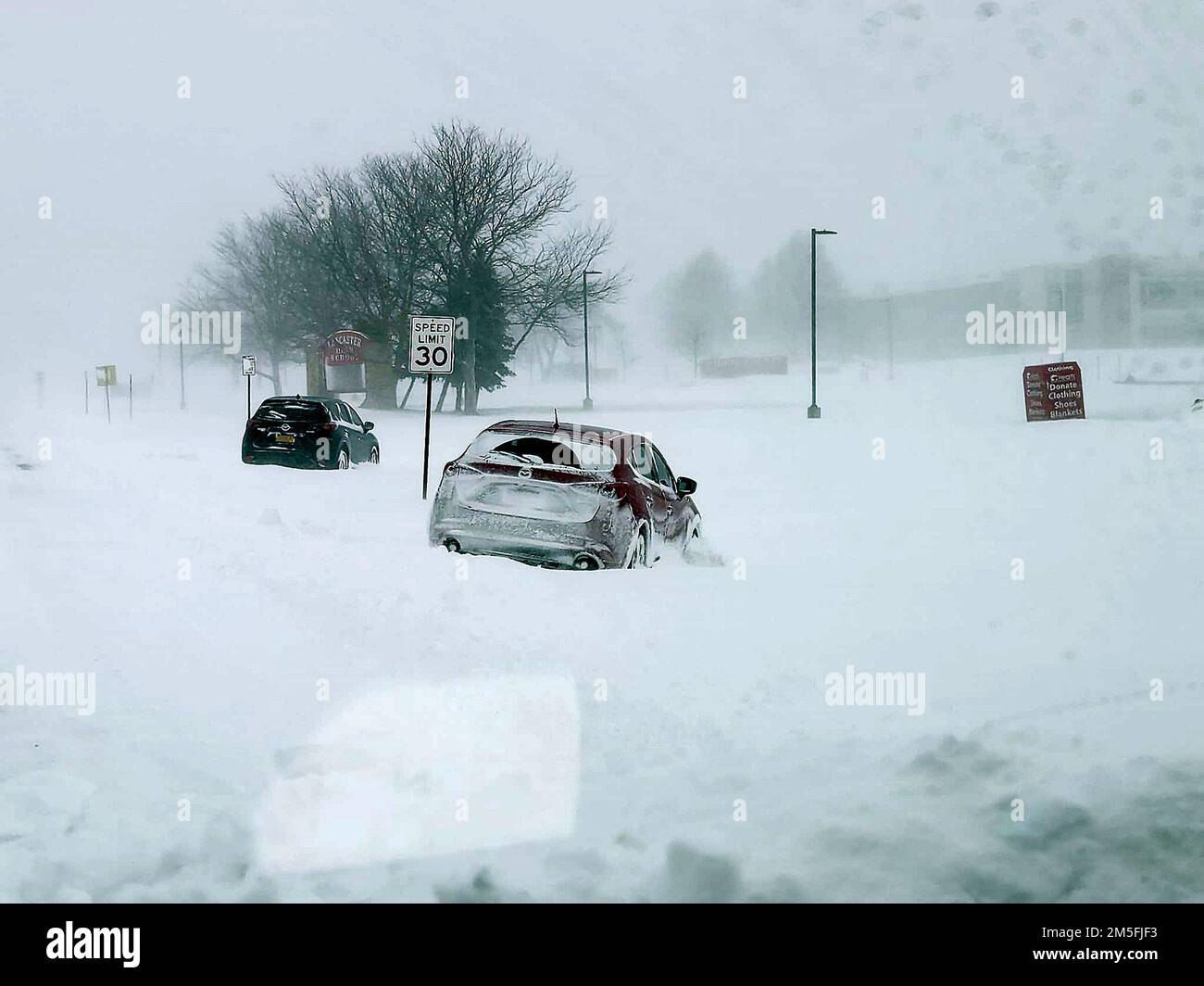 Lancaster, New York, USA. 24th Dec, 2022. Vehicles are left stranded on ...